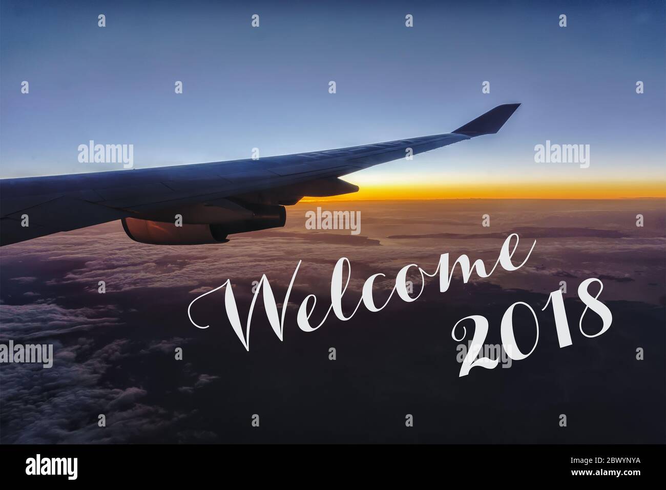 View from Aircraft windows to the plane wing with beautiful sunrise ...