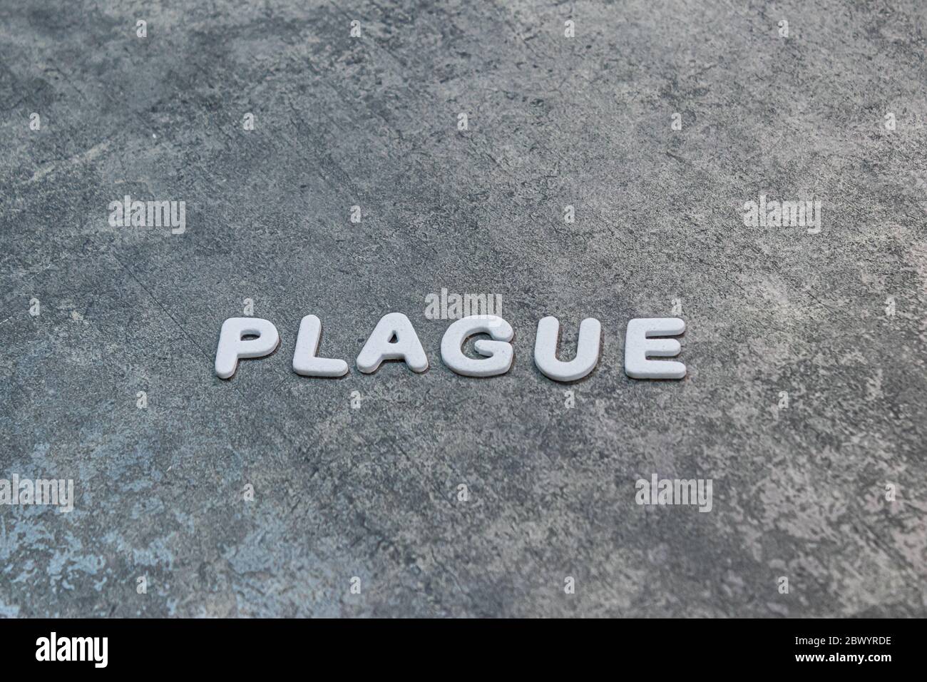 plague written out on gray background with white lettering centered ...