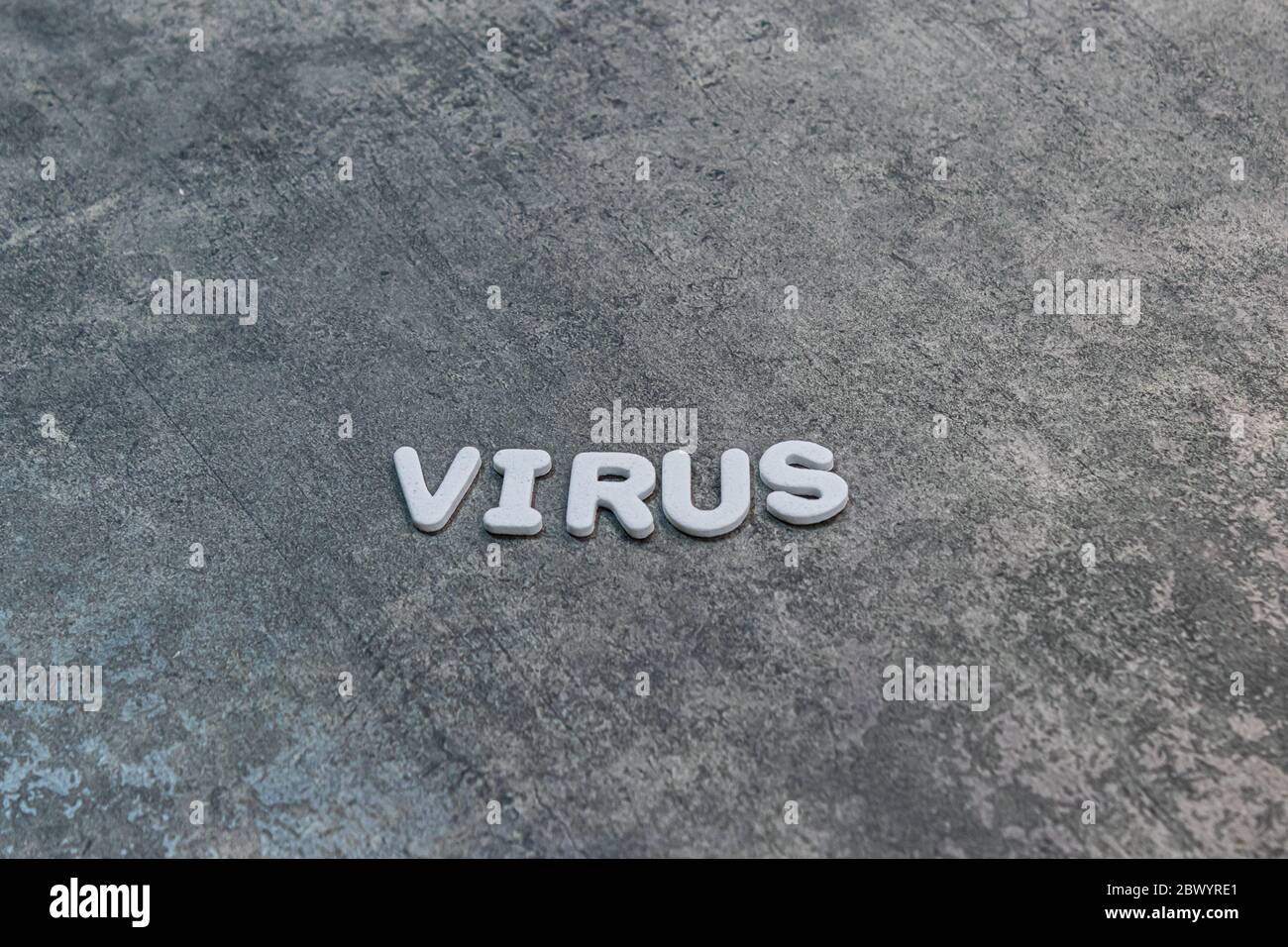 virus written out on gray background with white lettering centered ...