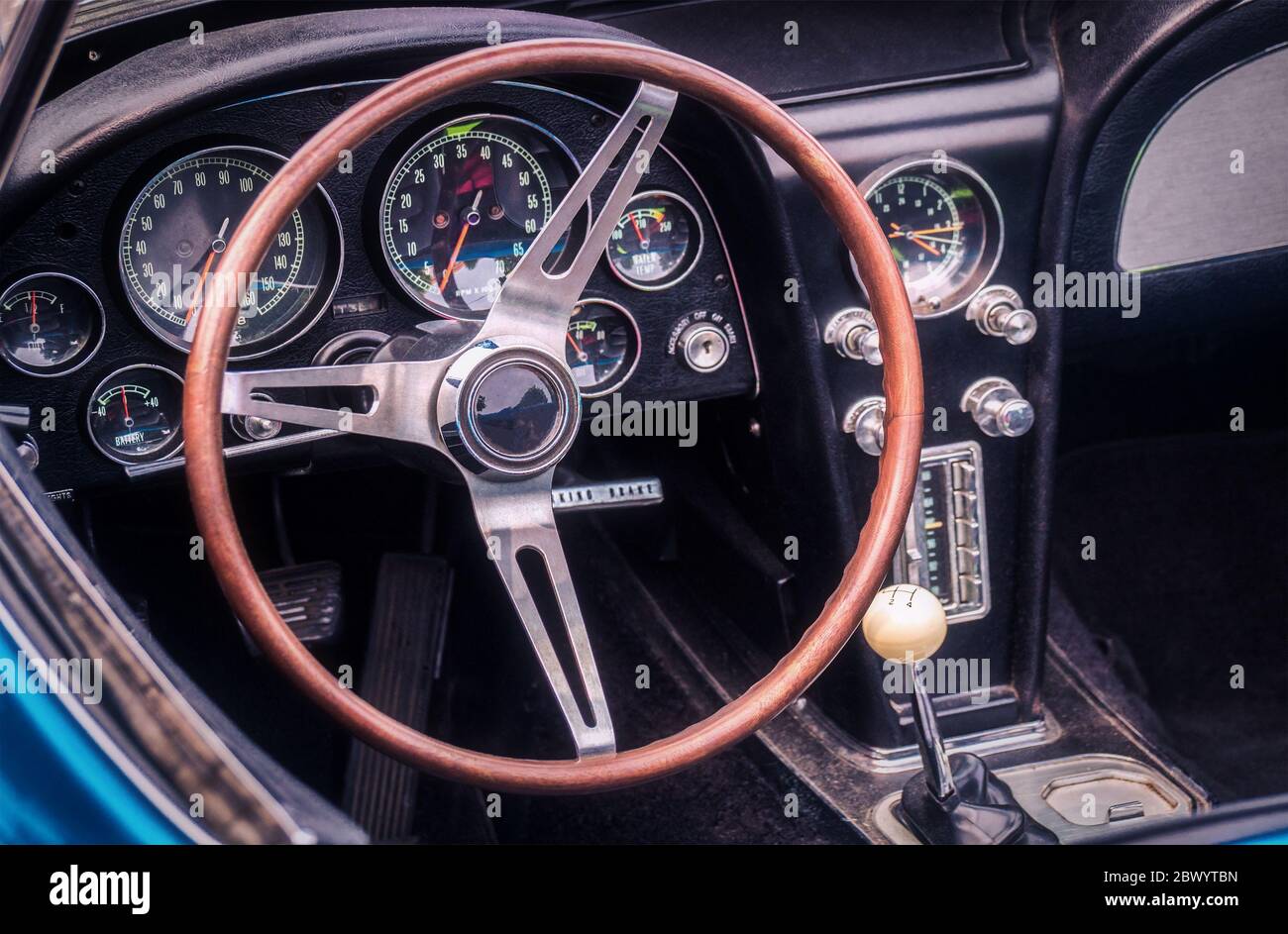 Part of the interior of an oldtimer luxury sports car with steering ...