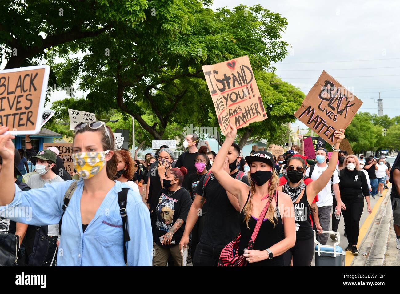 Miami, FL, USA. 02nd June, 2020. Protestors are seen holding signs and ...