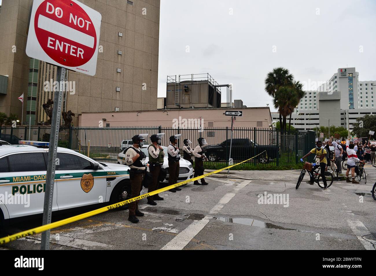 MIAMI, FL - June 02: Miami-Dade police officers watch as demonstrators ...