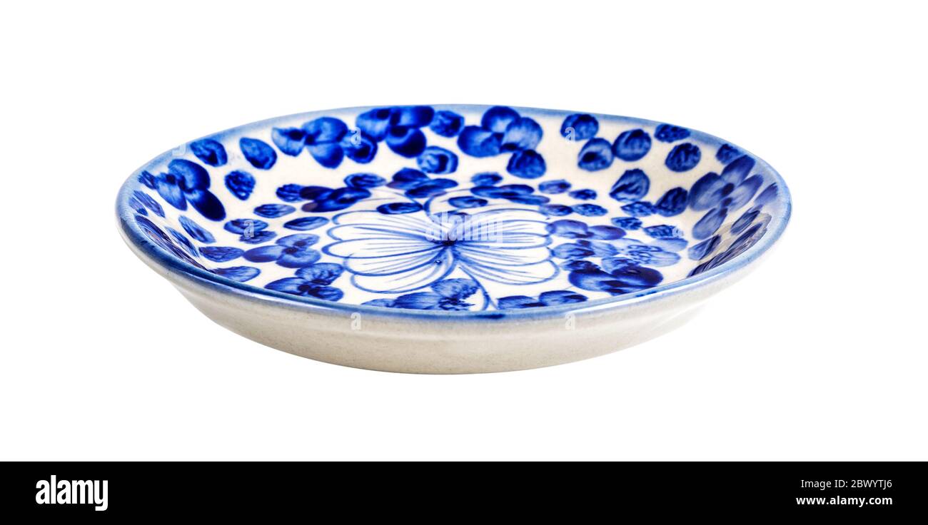ceramic dish with blue patterns isolated on white Stock Photo - Alamy