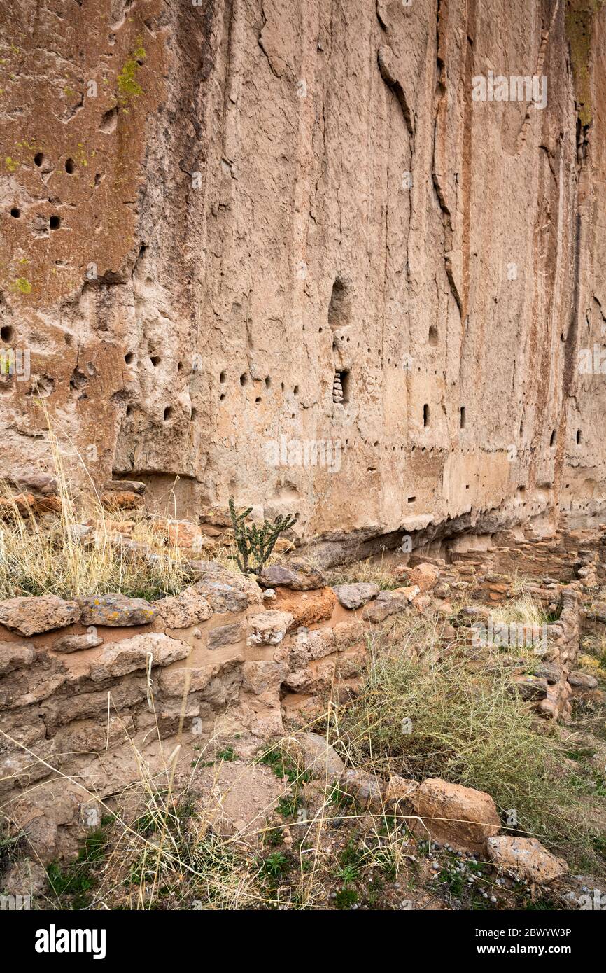 NM00466-00...NEW MEXICO - Ancient foundations at the base of a cliff ...