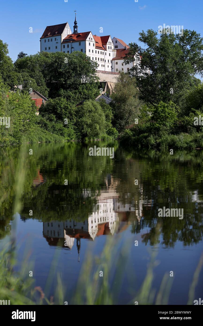 Colditz, Germany. 02nd June, 2020. Colditz Castle is reflected in the ...