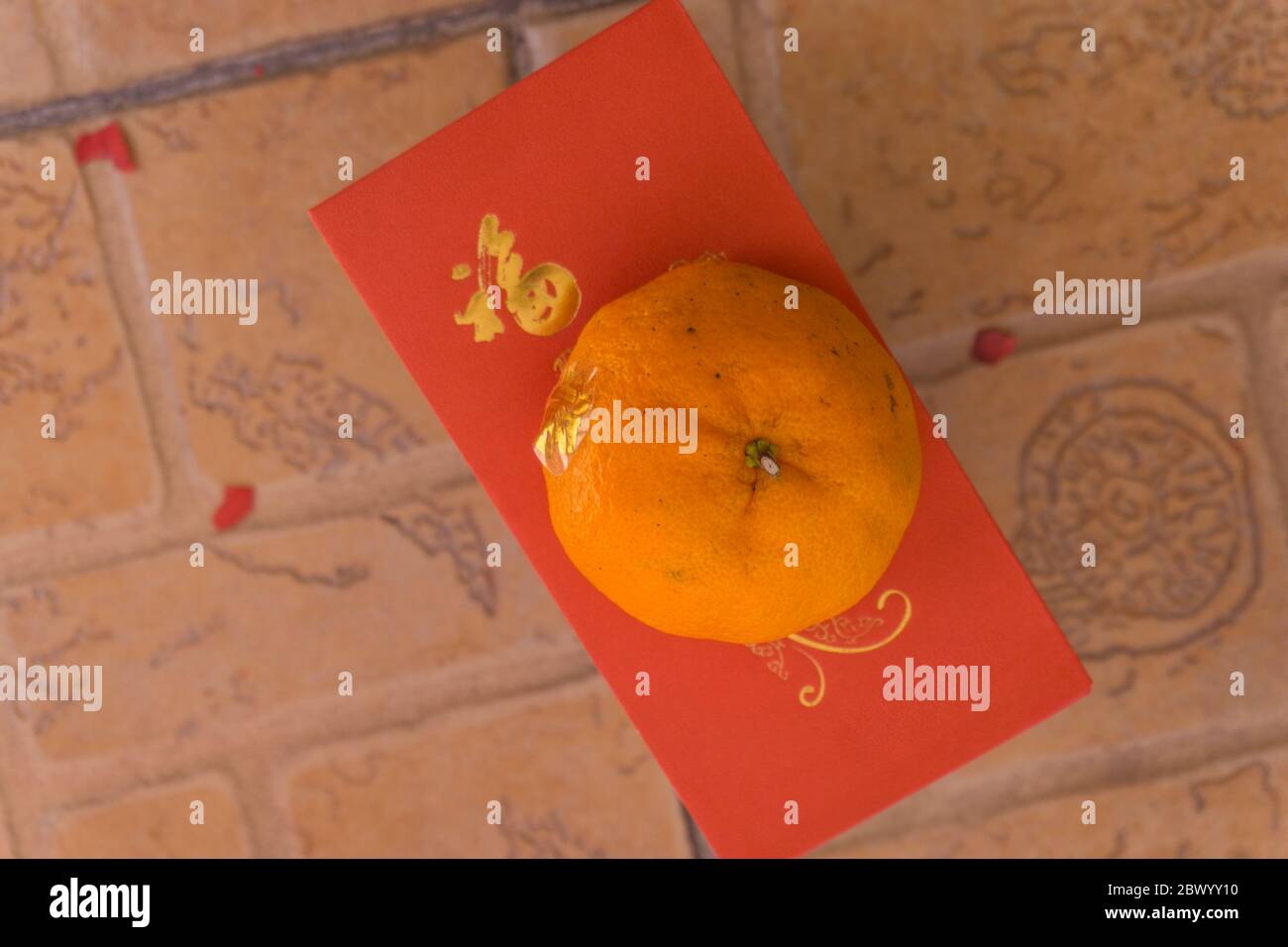 decoration of mandarin oranges and ang pow with Chinese caligraphy of ...