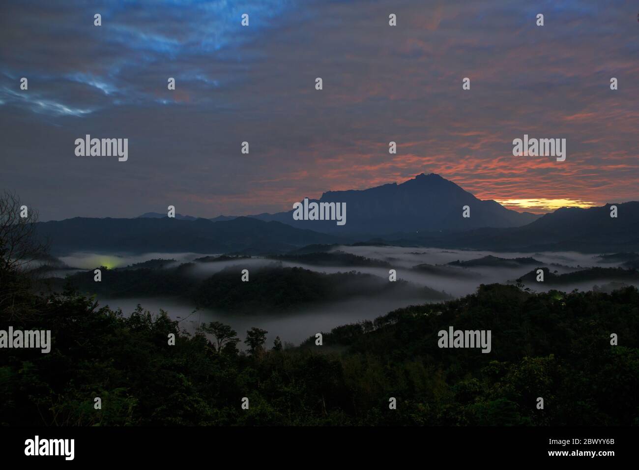 Beautiful sunrise landscape scenery with sunlight and fog and Mount ...