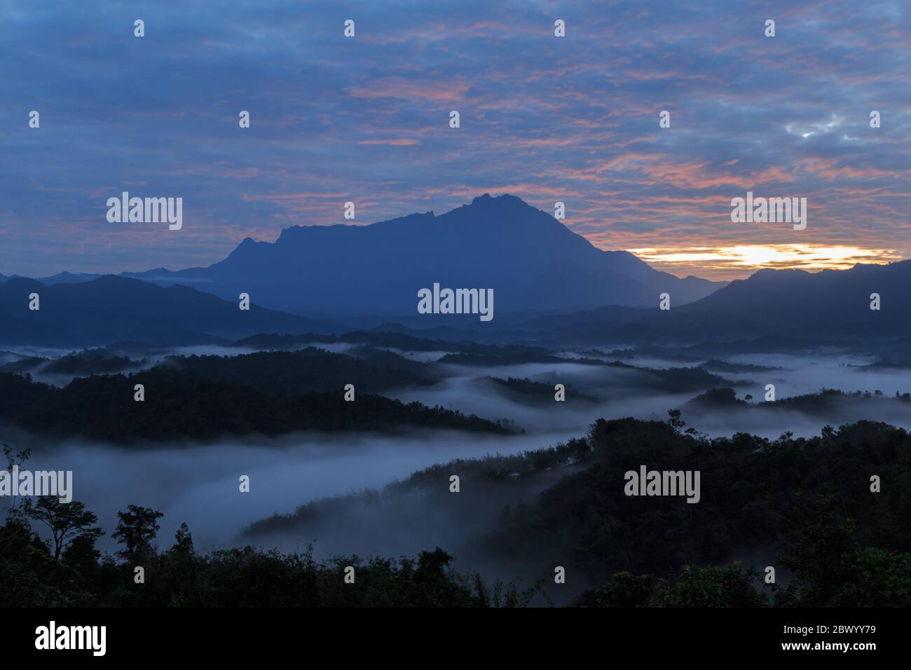 Beautiful sunrise landscape scenery with sunlight and fog and Mount ...