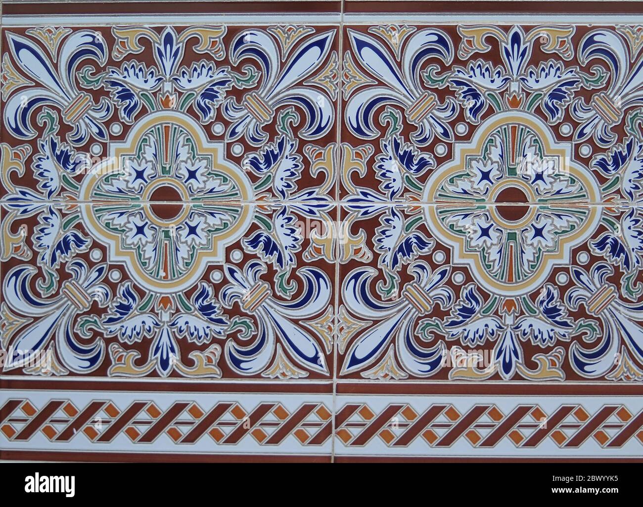 Closeup of Wall tiled with colorful ceramic tiles in village in ...