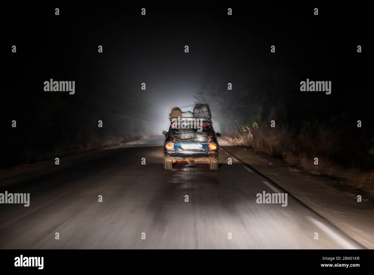 Africa, West Africa, Togo, kara. Togolese car driving at night on the ...