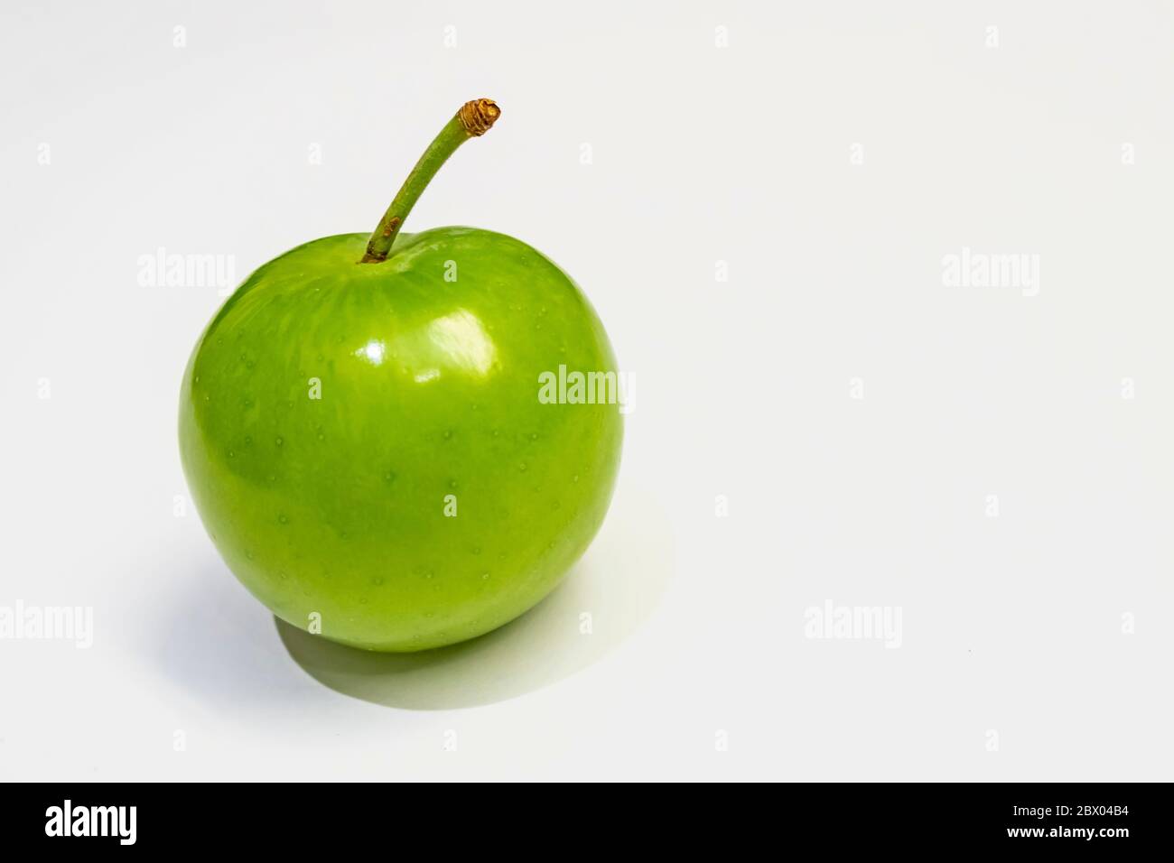 green plum on white background Stock Photo - Alamy