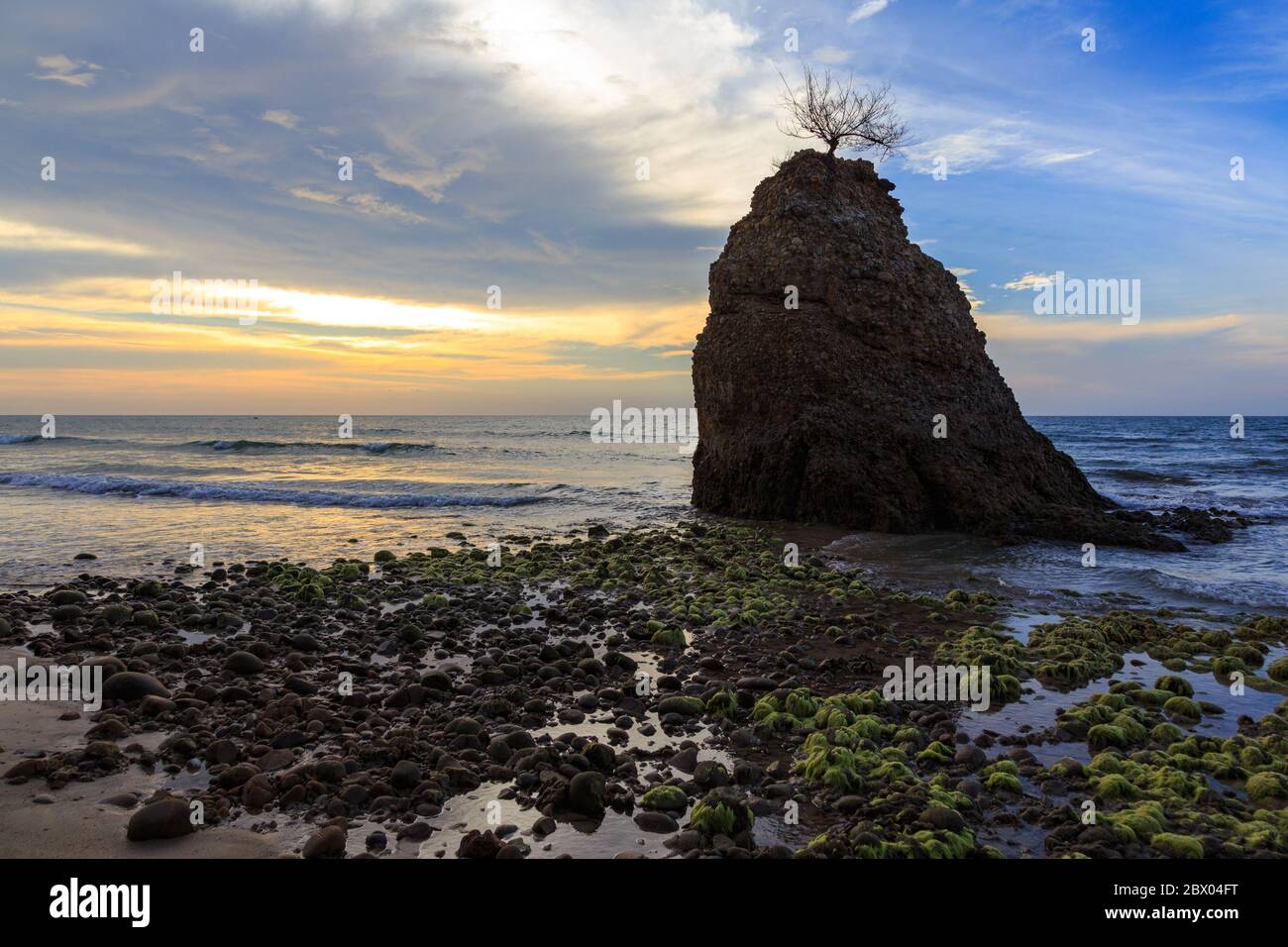 Green moss covered rocks boulders at Batu Luang, Kuala Penyu, Sabah ...