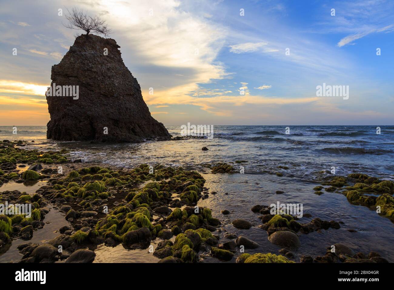 Green moss covered rocks boulders at Batu Luang, Kuala Penyu, Sabah ...