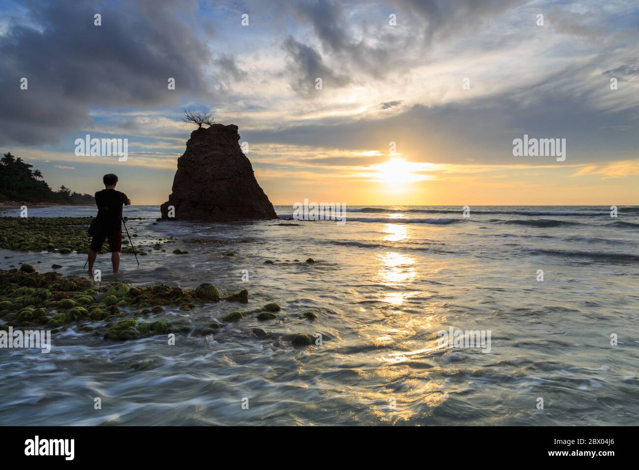 Green moss covered rocks boulders at Batu Luang, Kuala Penyu, Sabah ...