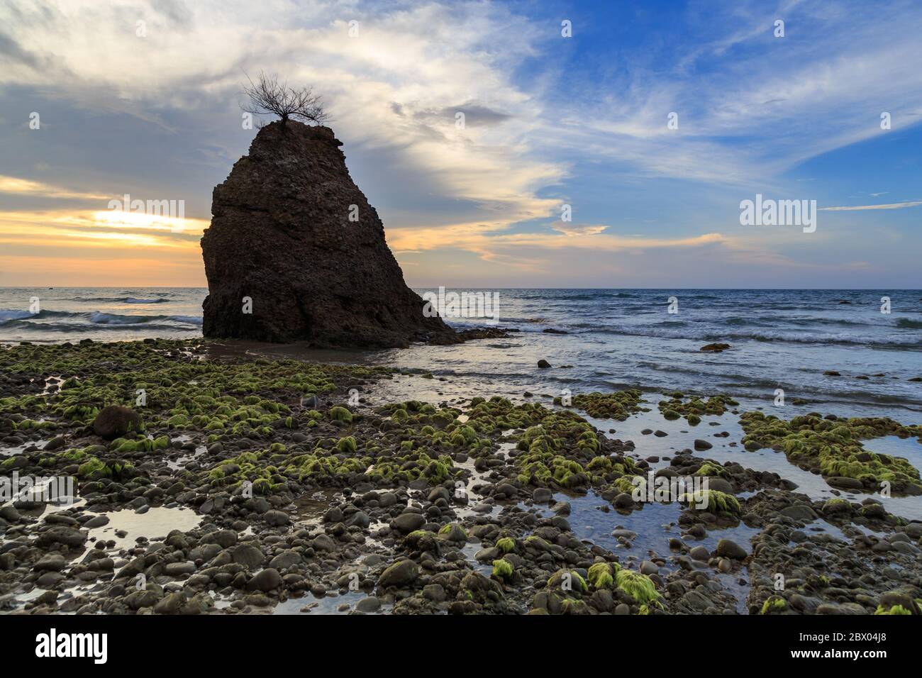 Green moss covered rocks boulders at Batu Luang, Kuala Penyu, Sabah ...