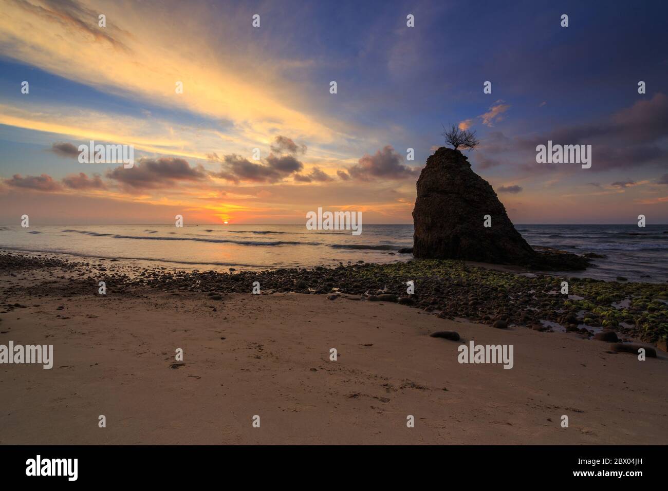 Green moss covered rocks boulders at Batu Luang, Kuala Penyu, Sabah ...