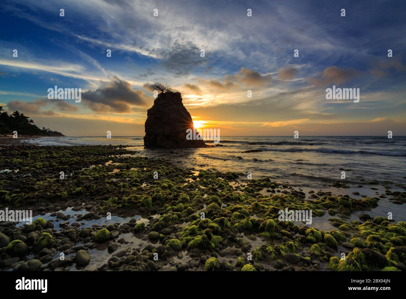 Green moss covered rocks boulders at Batu Luang, Kuala Penyu, Sabah ...