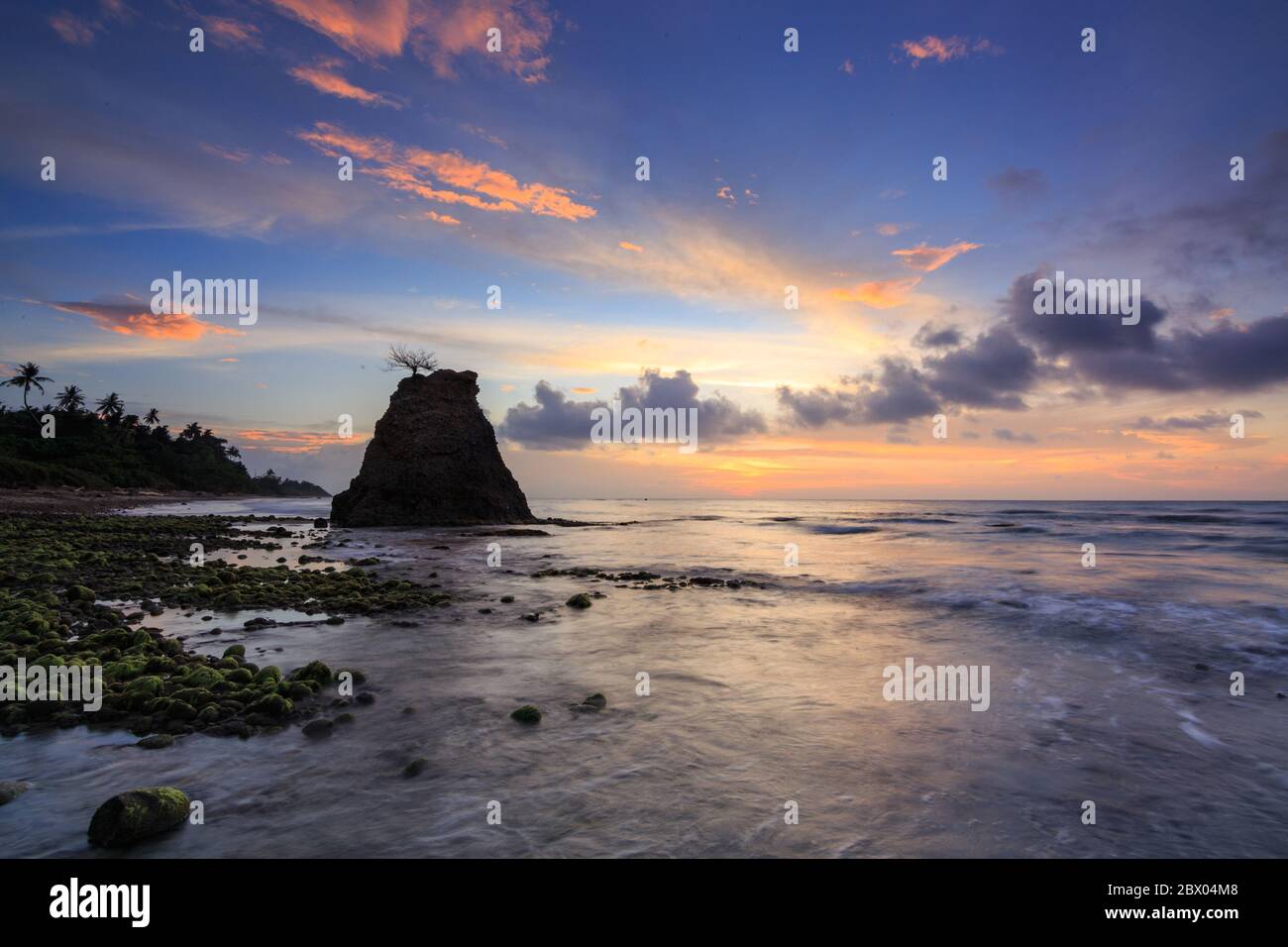 Green moss covered rocks boulders at Batu Luang, Kuala Penyu, Sabah ...