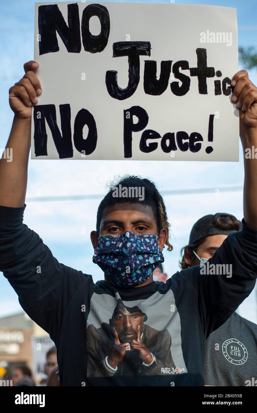 Manhattan, Kansas, USA. 2nd June, 2020. Peaceful protesters hold signs ...
