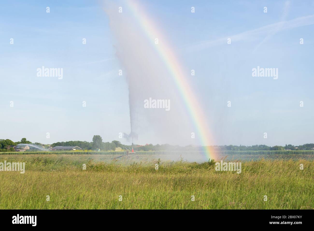 Bright rainbow caused by diffraction of sunlight in water droplets of ...