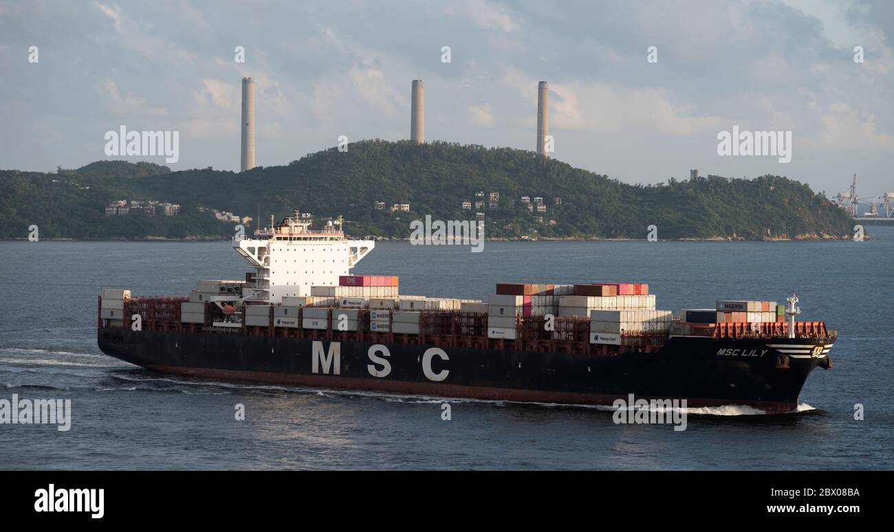 Container ships transporting cargo into Hong Kong from mainland China ...