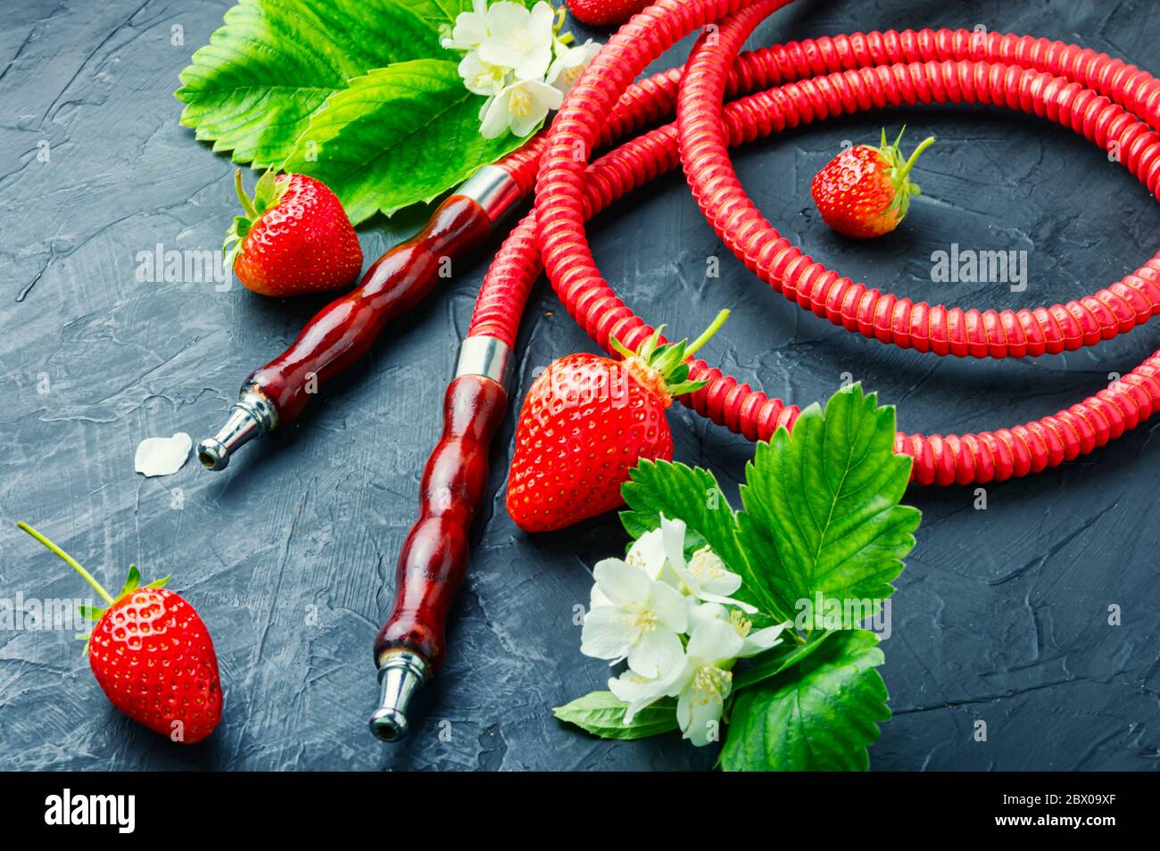 Oriental smoking shisha with strawberry tobacco. Berry hookah tobacco ...