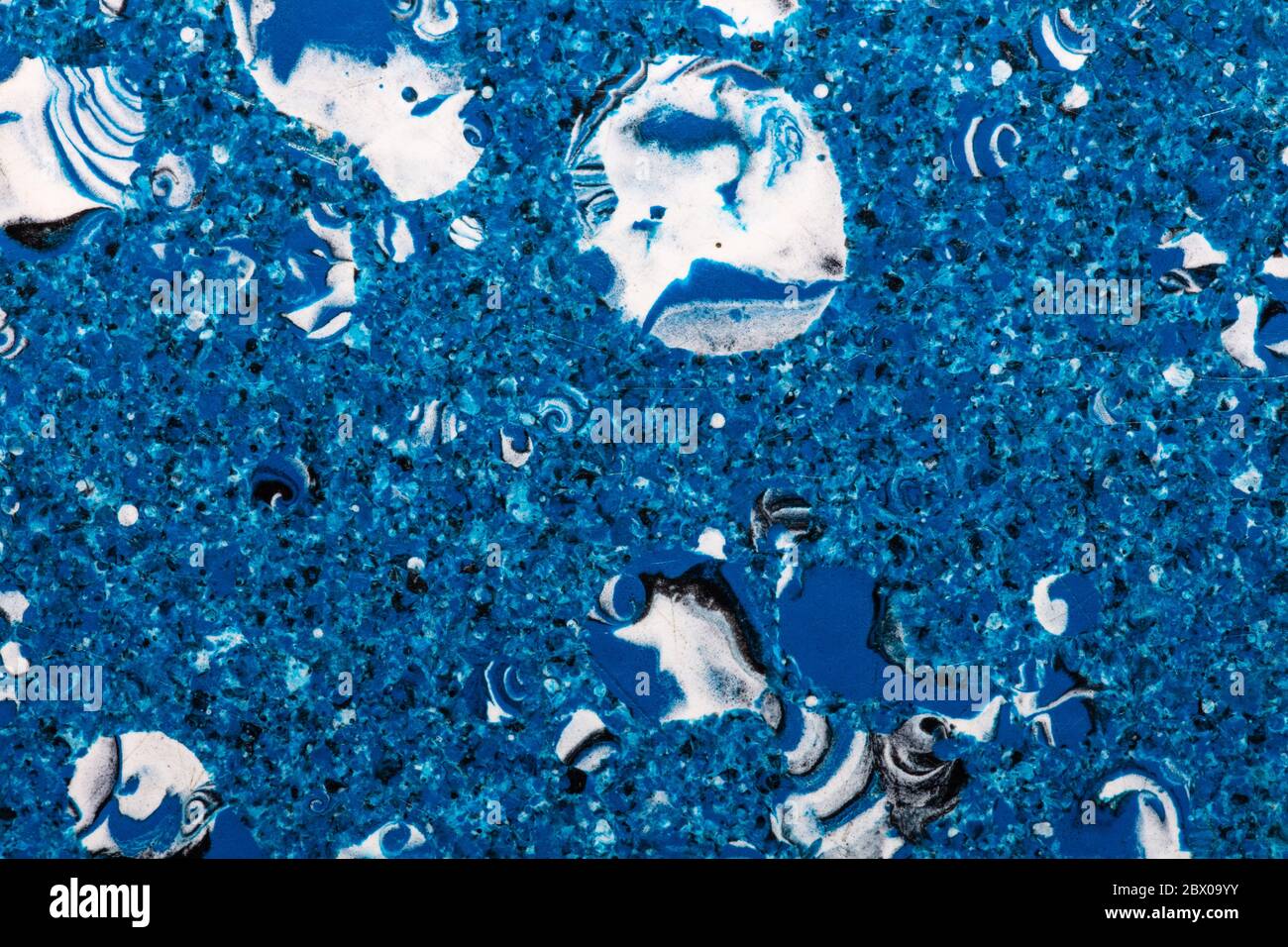 Grainy and bubbly blue plastic surface. Top view. Close-up shot ...