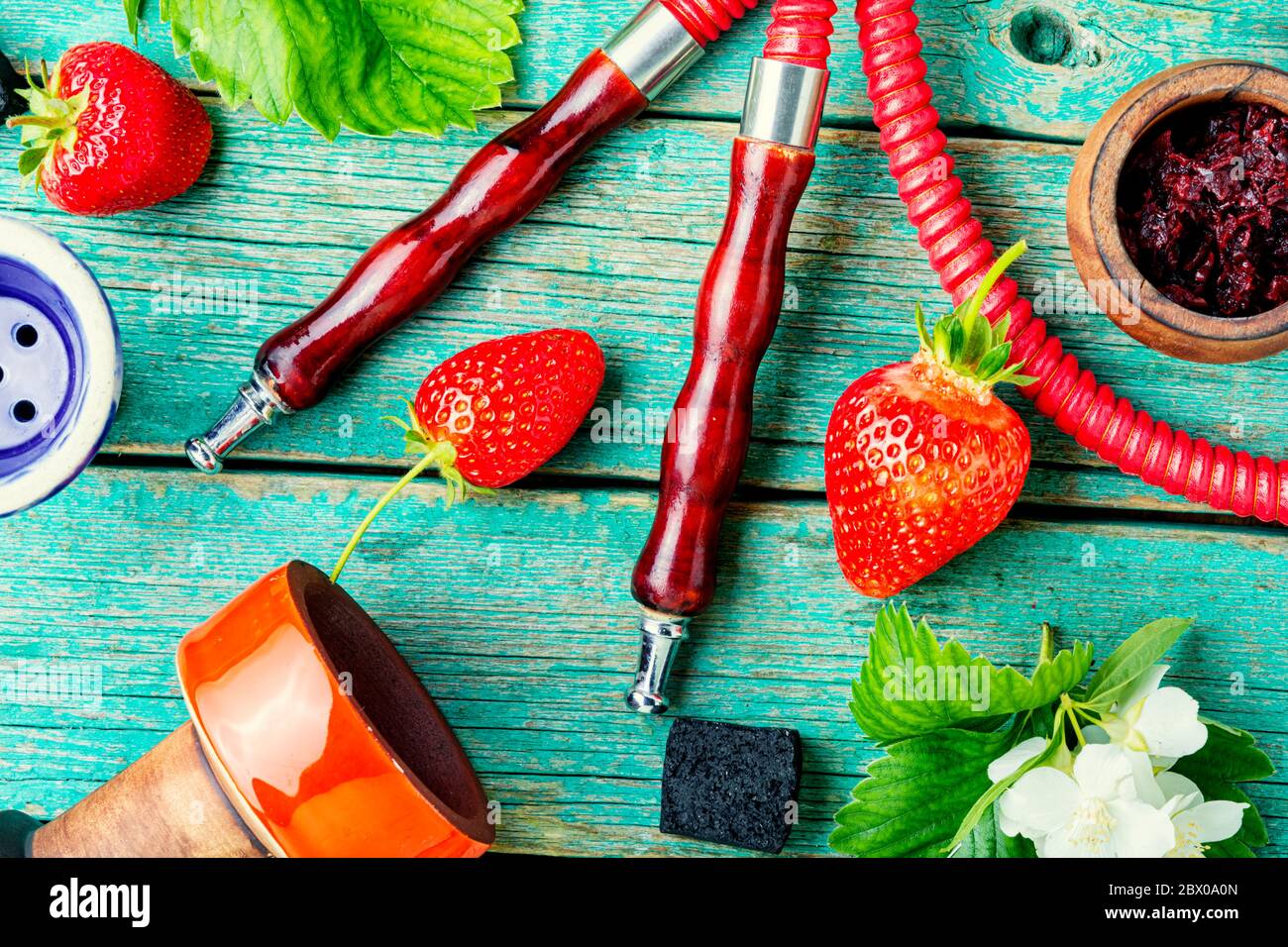 Oriental smoking shisha with strawberry tobacco. Berry hookah tobacco ...