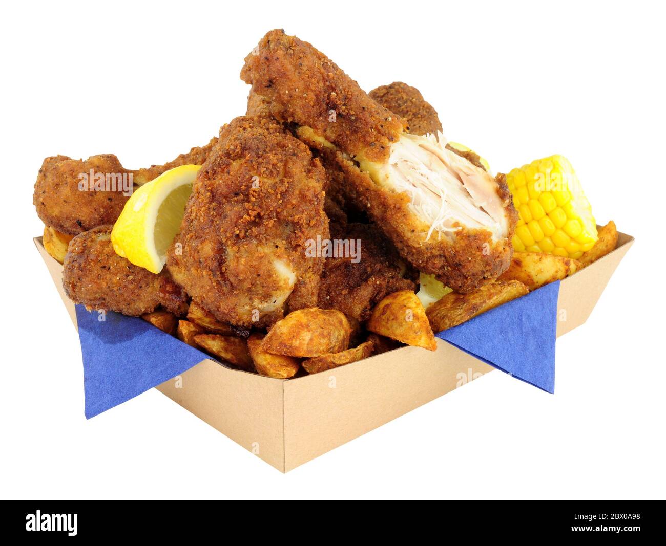 Southern fried chicken portions in a cardboard take away tray isolated ...