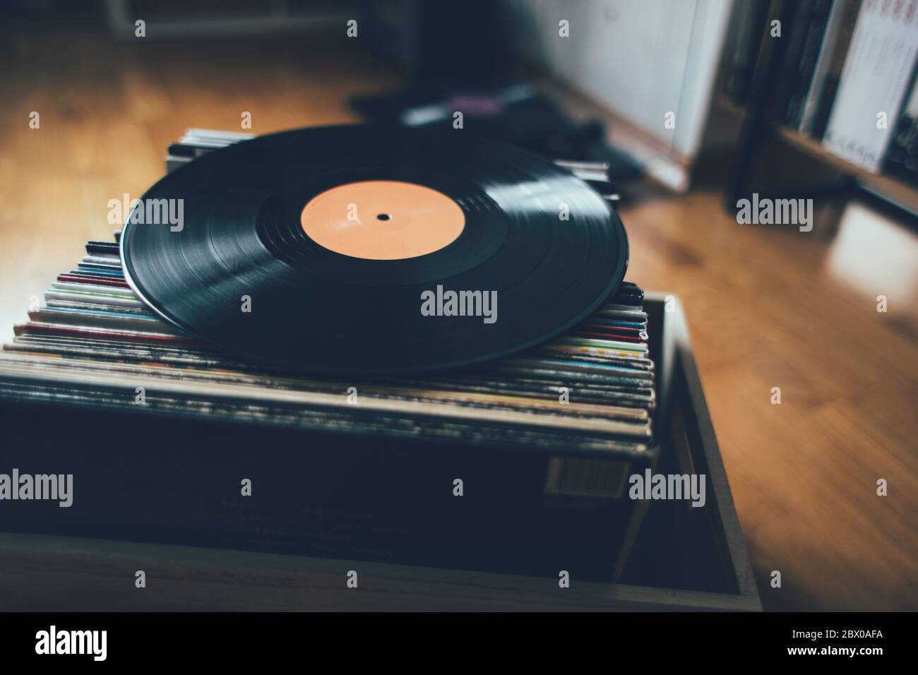 Vinyl record on stack of records collection Stock Photo - Alamy