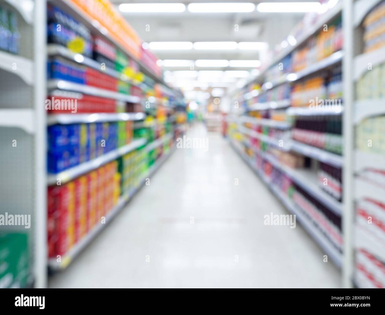 Supermarket blur background. Blurred interior view with walkway between ...