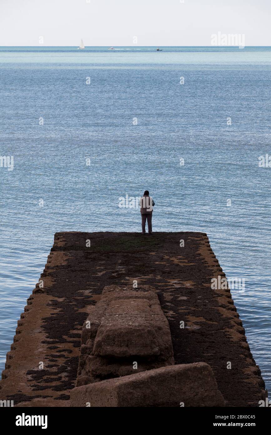 Rear man walking on jetty hi-res stock photography and images - Alamy