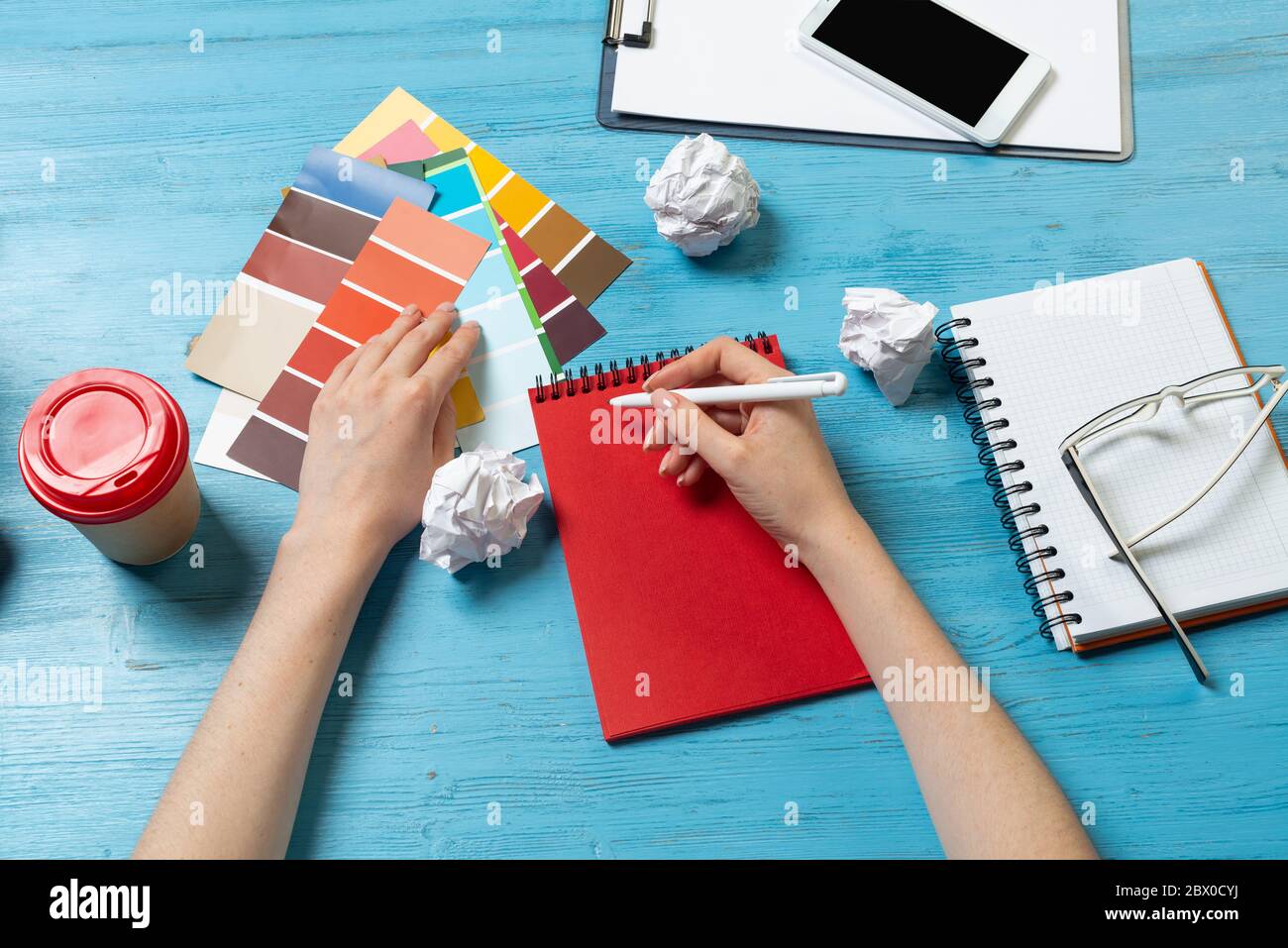 Interior designer choosing colors from swatches Stock Photo - Alamy
