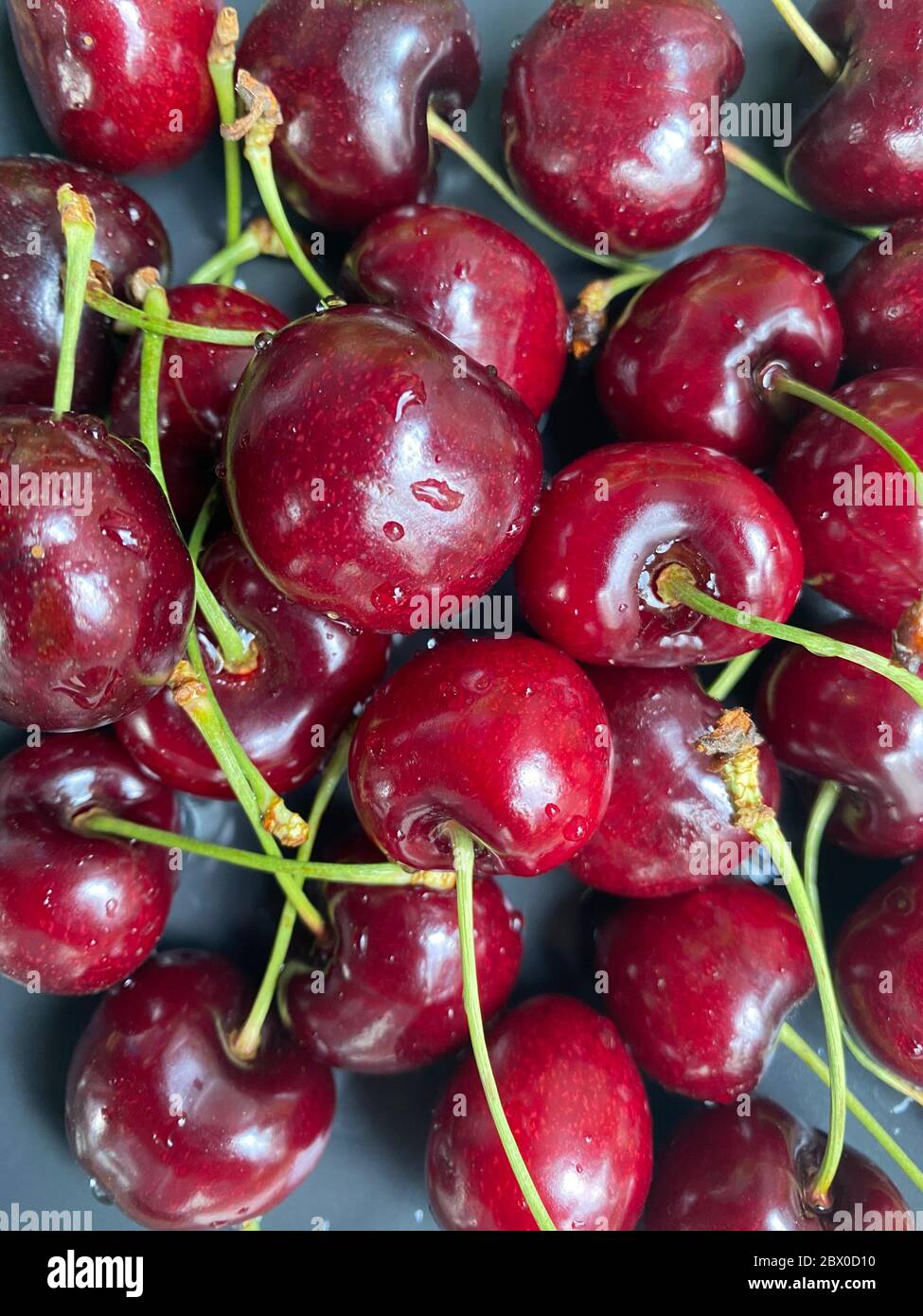 Top view cherry in plate, closeup Stock Photo - Alamy
