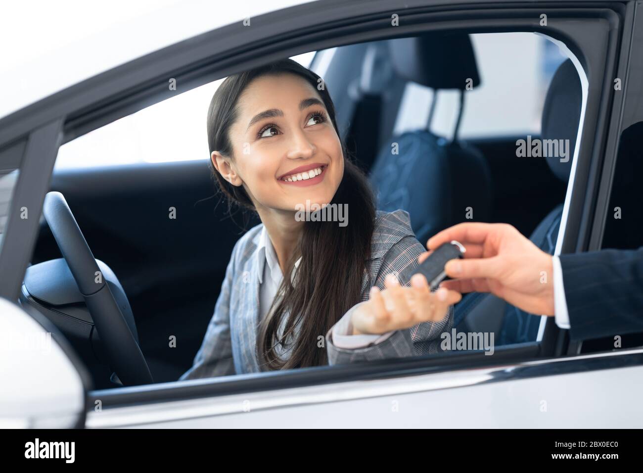 Girl Taking Key From Seller For Test Drive Stock Photo - Alamy