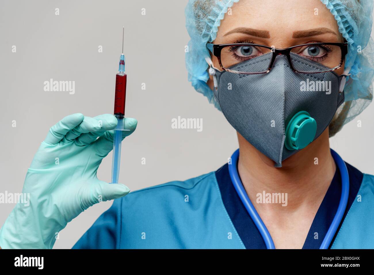 medical doctor nurse woman wearing protective mask and gloves - holding ...