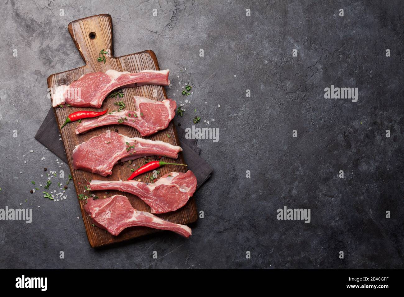 Lamb ribs cooking. Raw rack of lamb with spices and condiments. Top ...