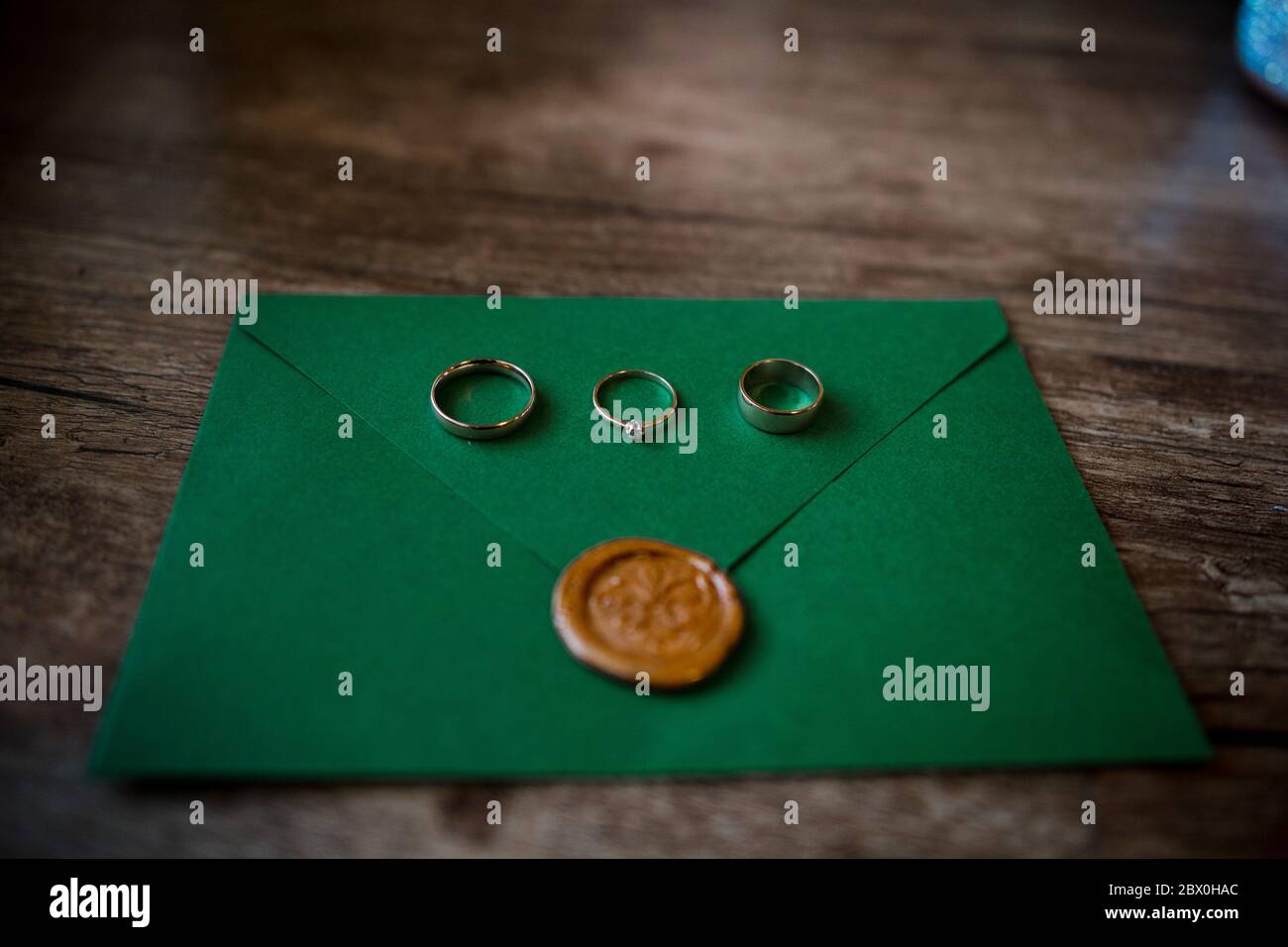 a wedding gold rings on the table Stock Photo - Alamy
