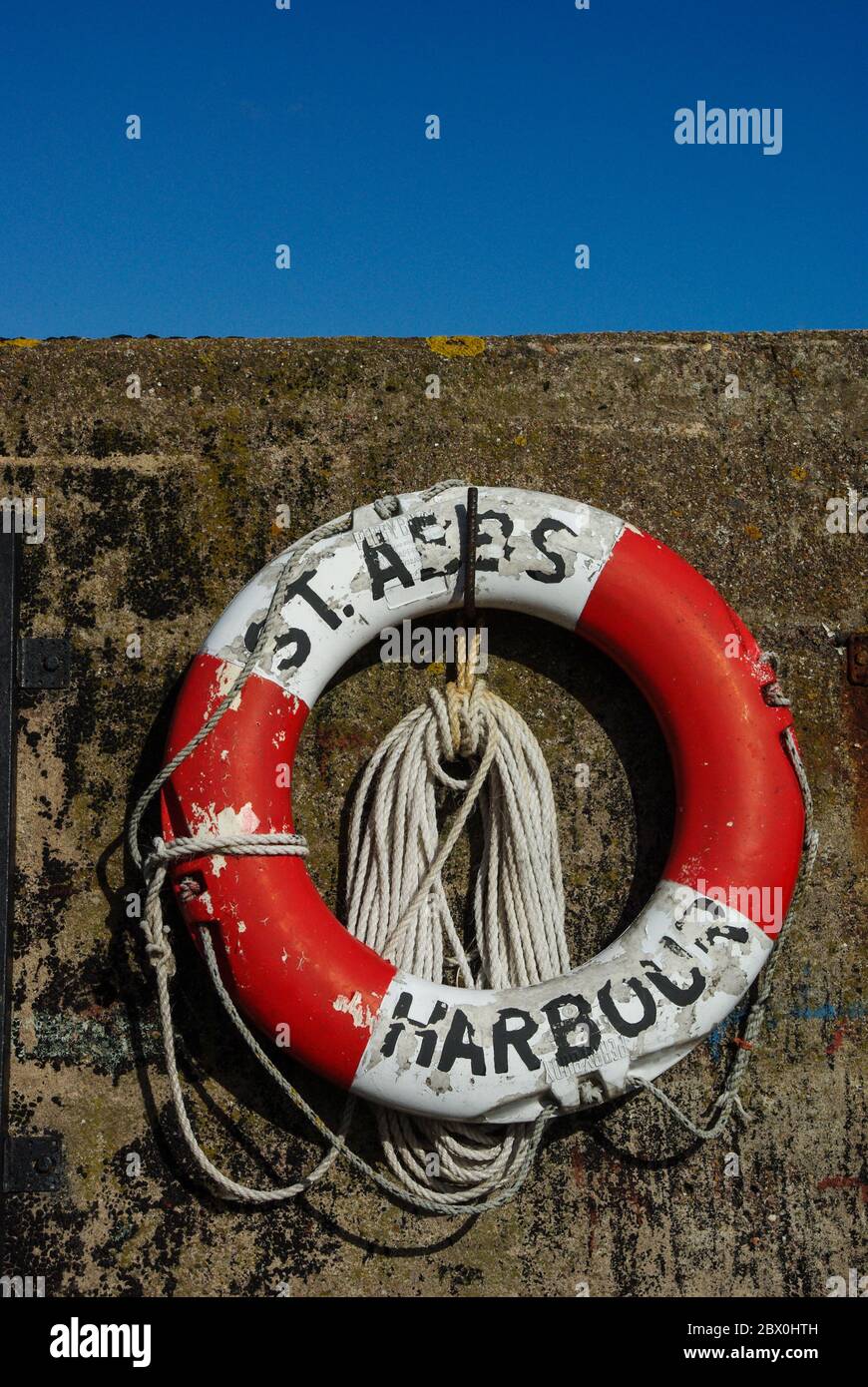 Life saving ring on the harbour wall at St Abbs, Borders, Scotland ...
