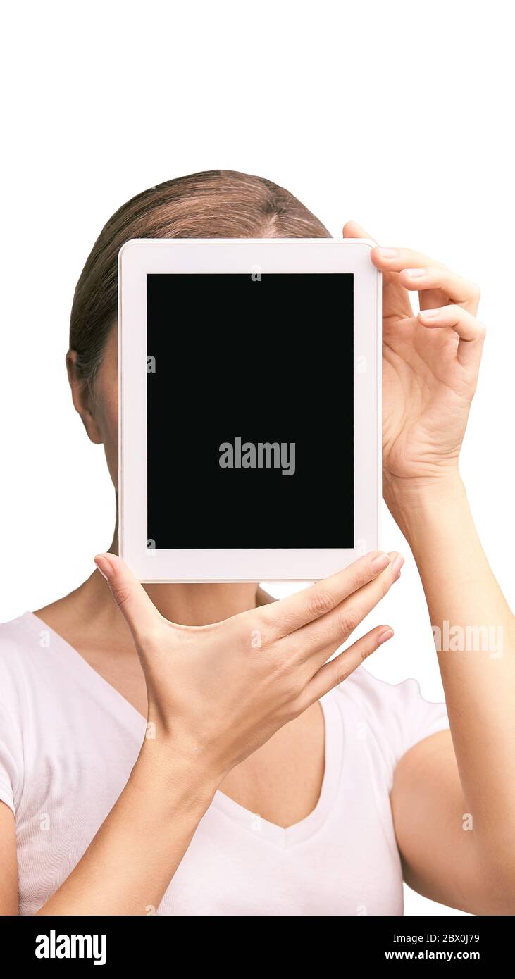 Girl holding computer pad. Mock up at tablet black screen. Face near ...