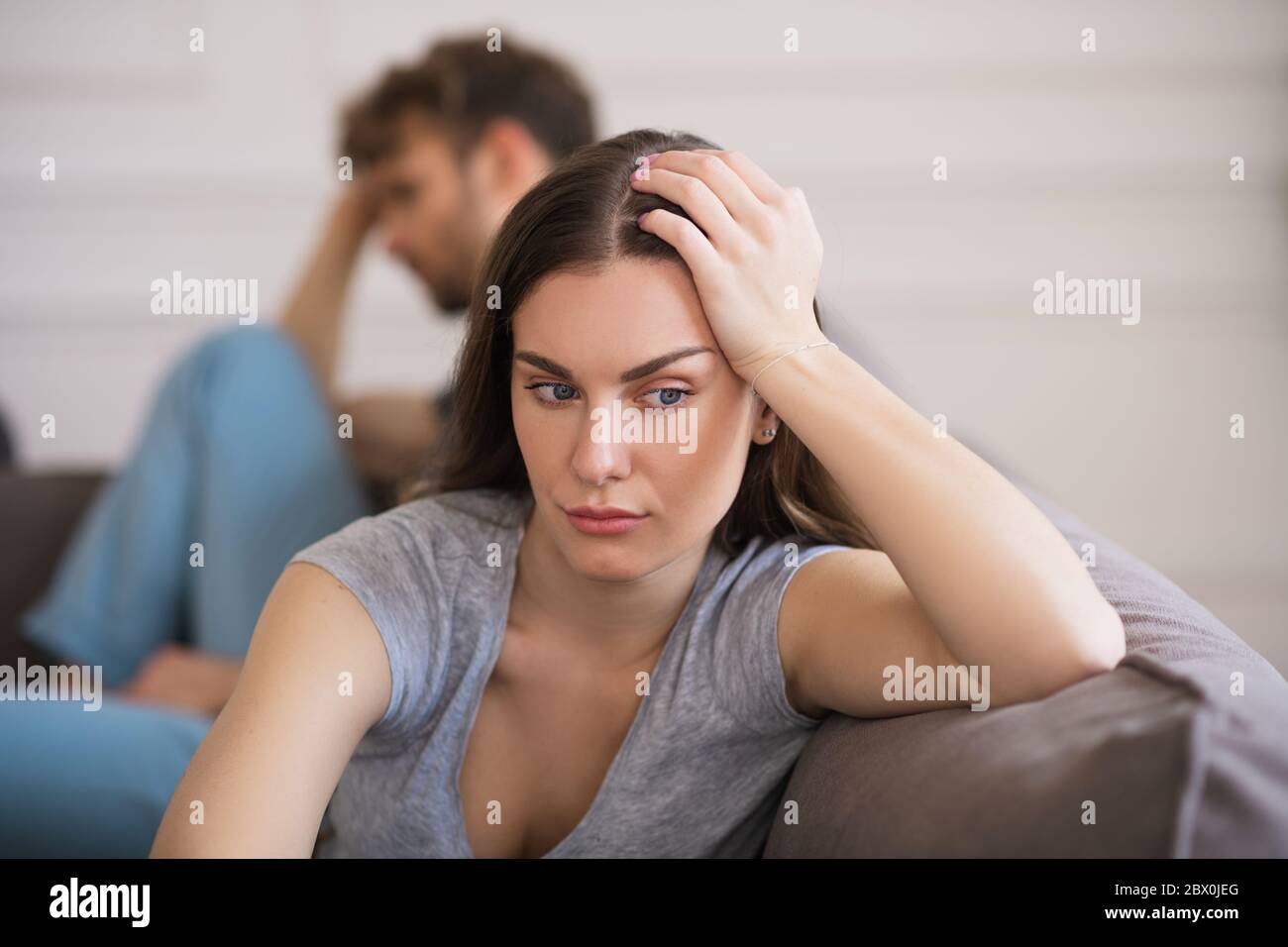 Young woman sit looking sad after a bad talk with her husband Stock ...