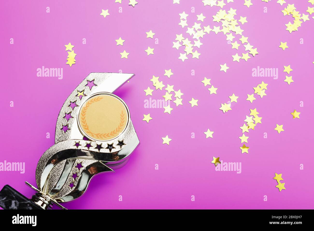 Golden superprize with a scattering of stars on a pink background Stock ...