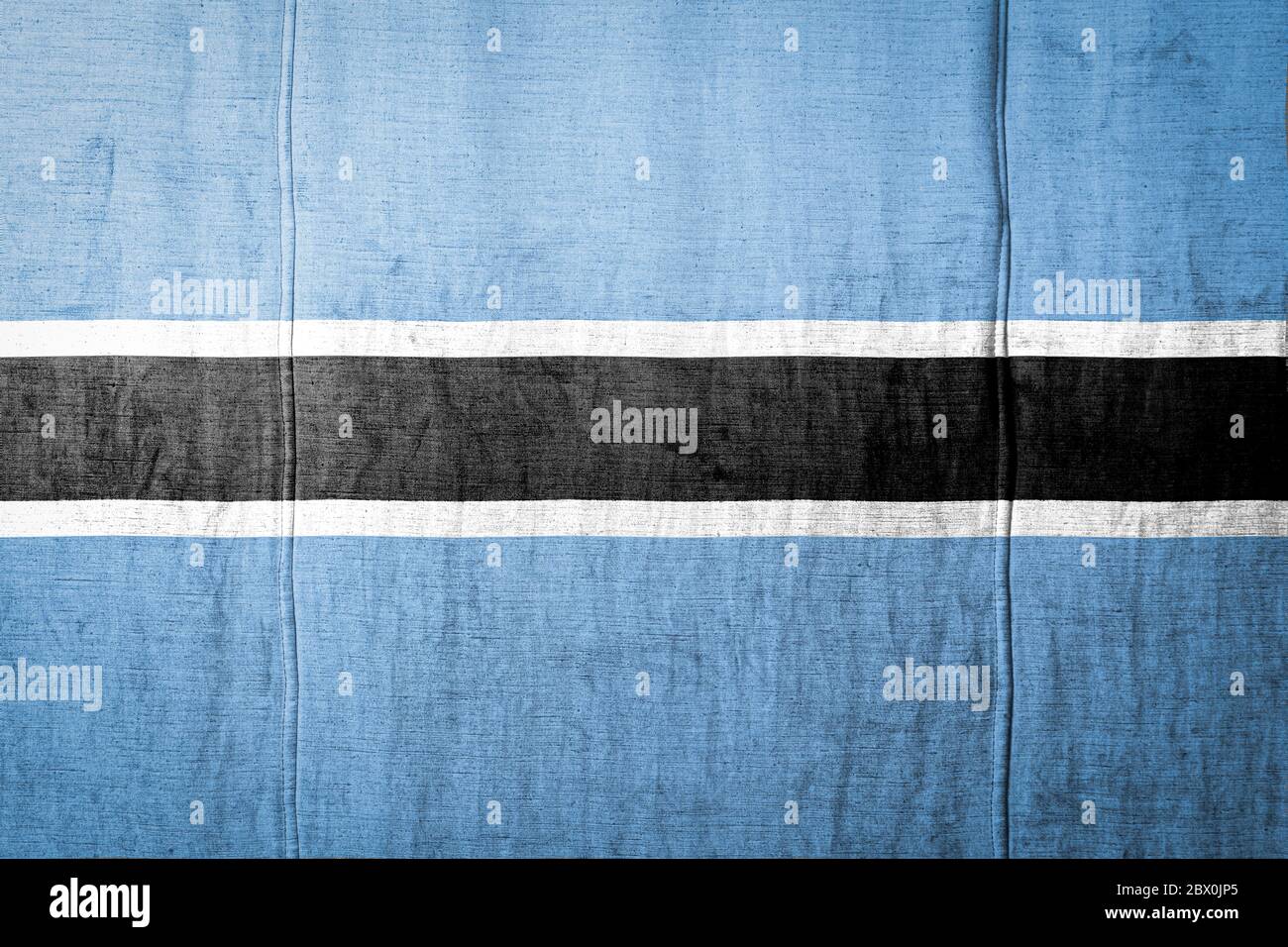 National flag of Botswana depicting in paint colors on old clothl. Flag ...