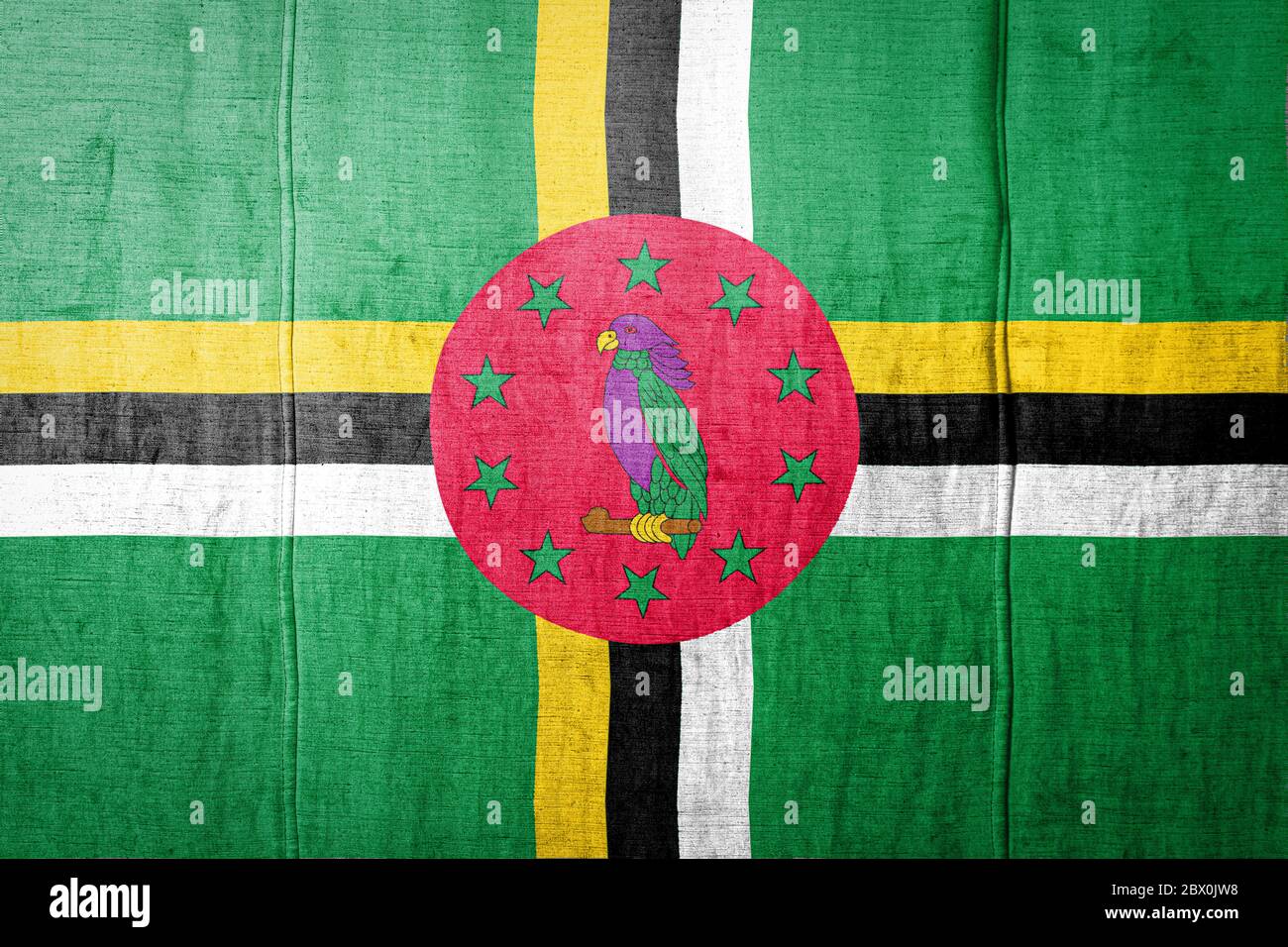 National flag of Dominica depicting in paint colors on old clothl. Flag ...