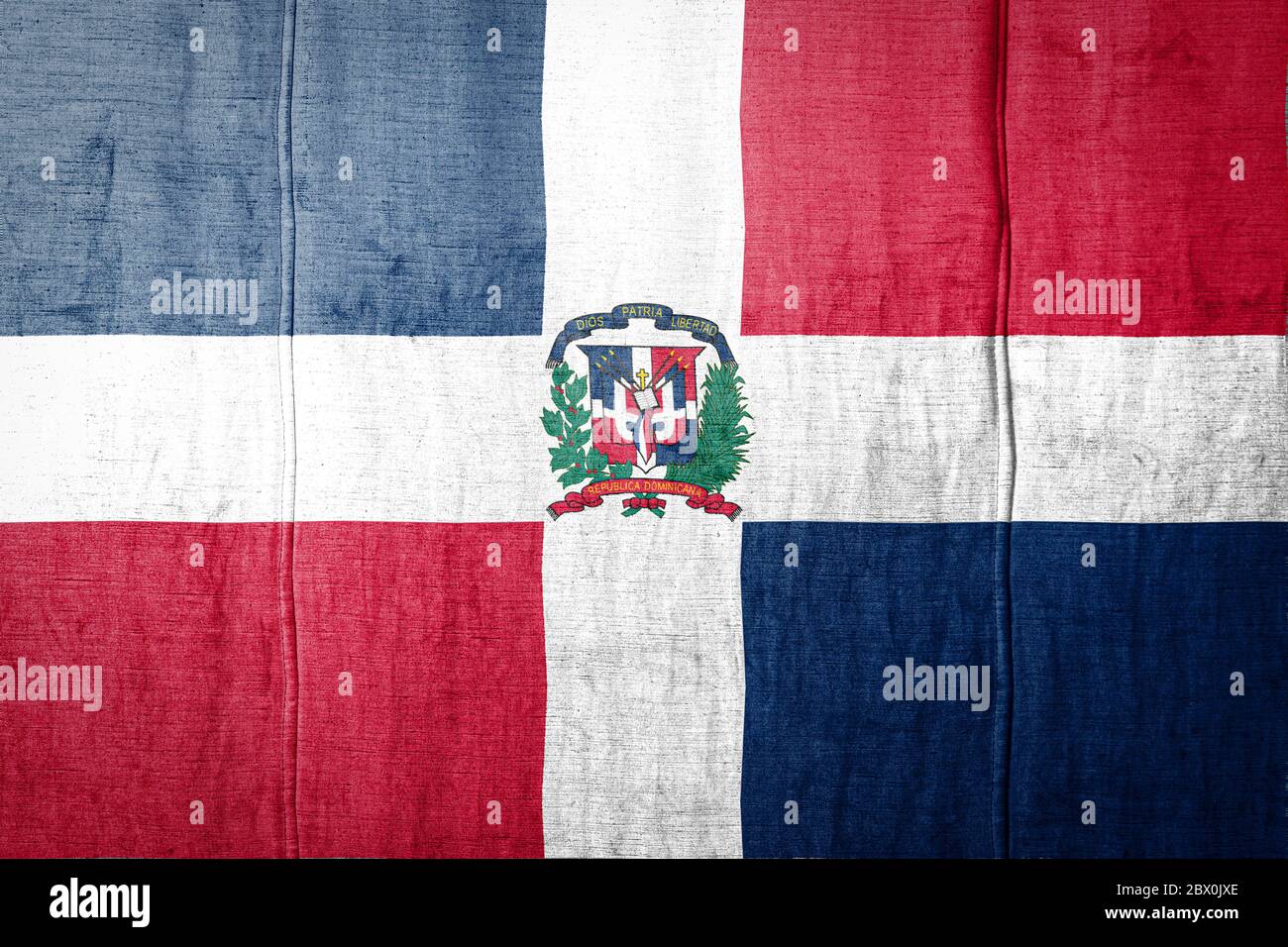 National flag of Dominicana depicting in paint colors on old clothl ...
