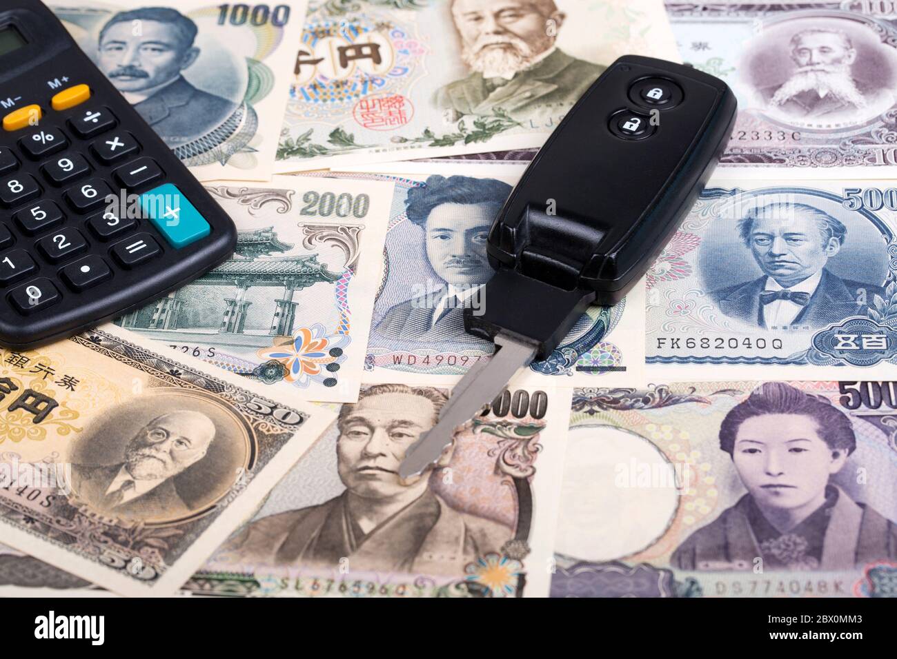 Car key on a Japanese money background Stock Photo - Alamy