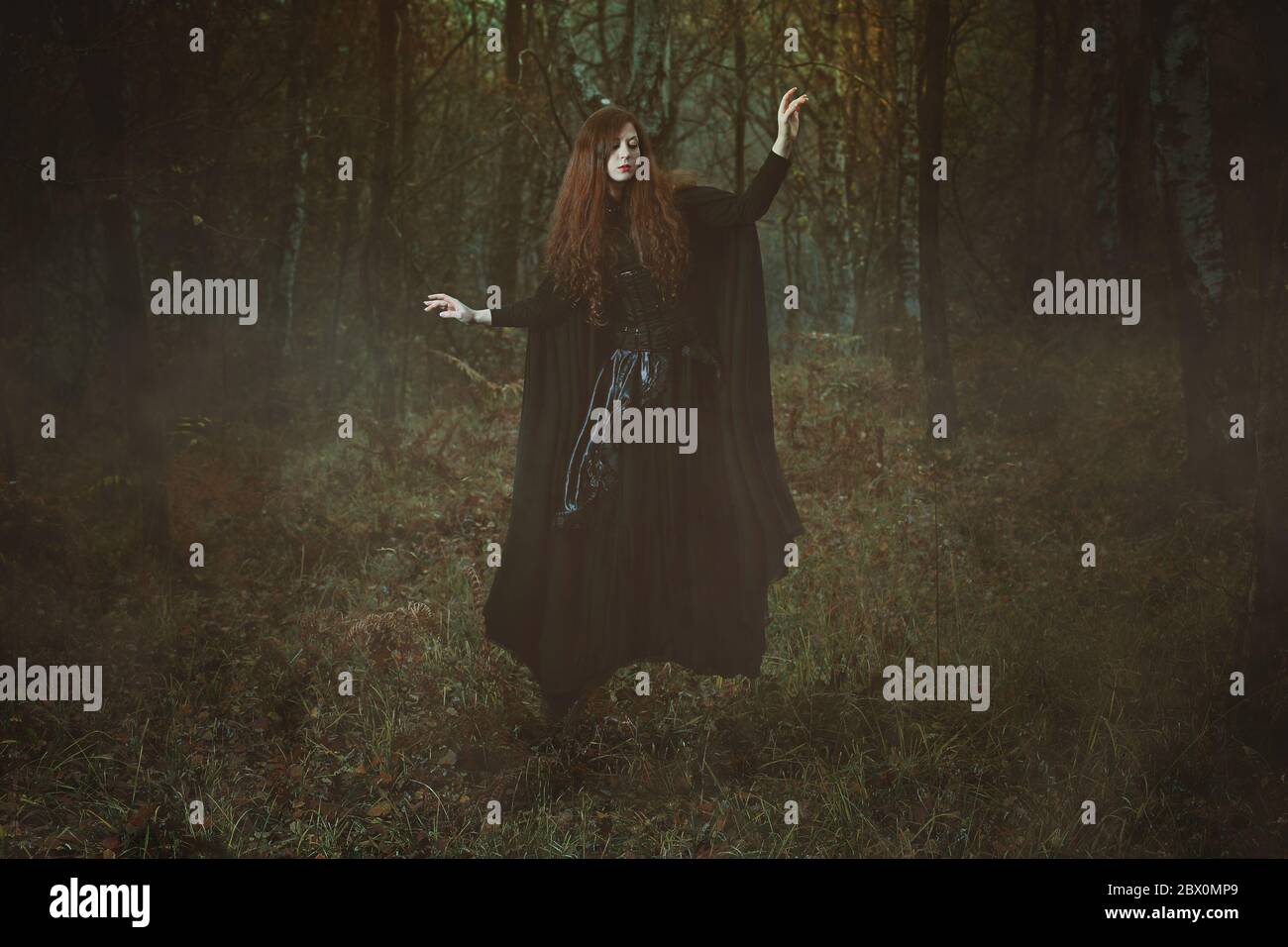 Powerful forest witch levitation . Dark fantasy and magic Stock Photo ...
