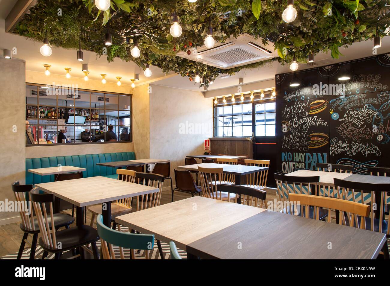 Elegant and modern restaurant with wooden walls and ceramic floors ...