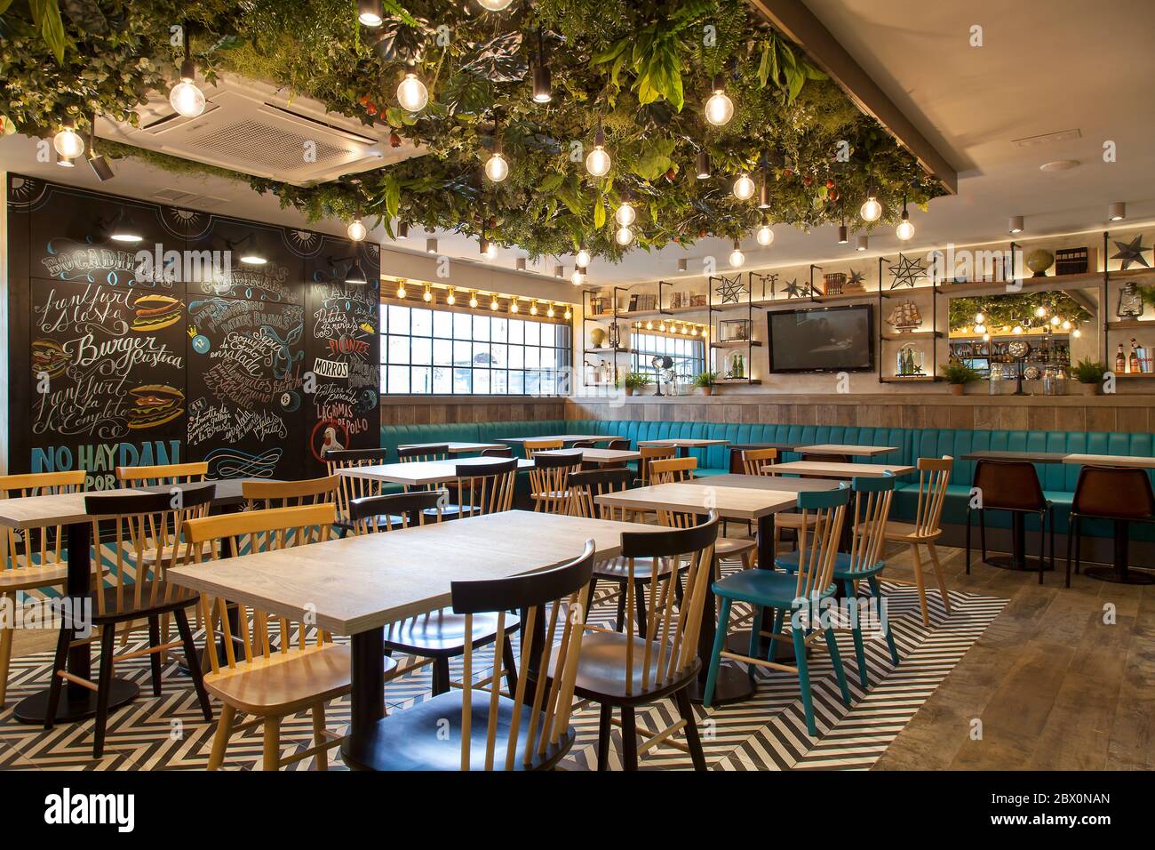 Elegant and modern restaurant with wooden walls and ceramic floors ...