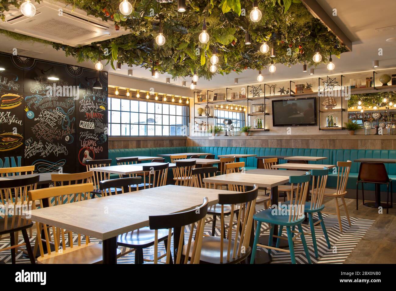 Elegant and modern restaurant with wooden walls and ceramic floors ...